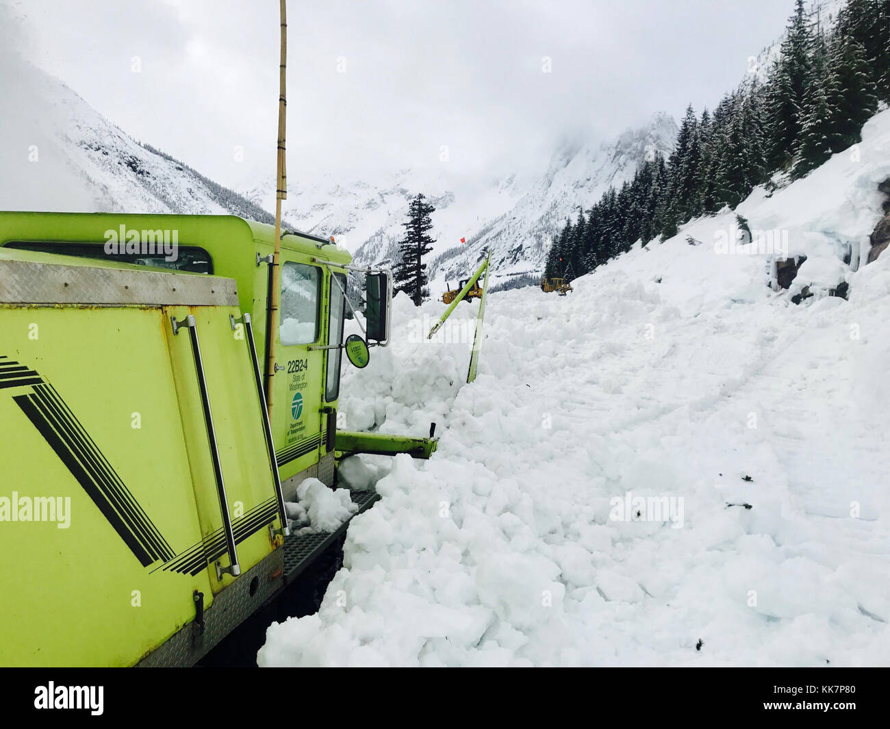 The Kodiak snow blower follows the Caterpillars and clears the snow ...