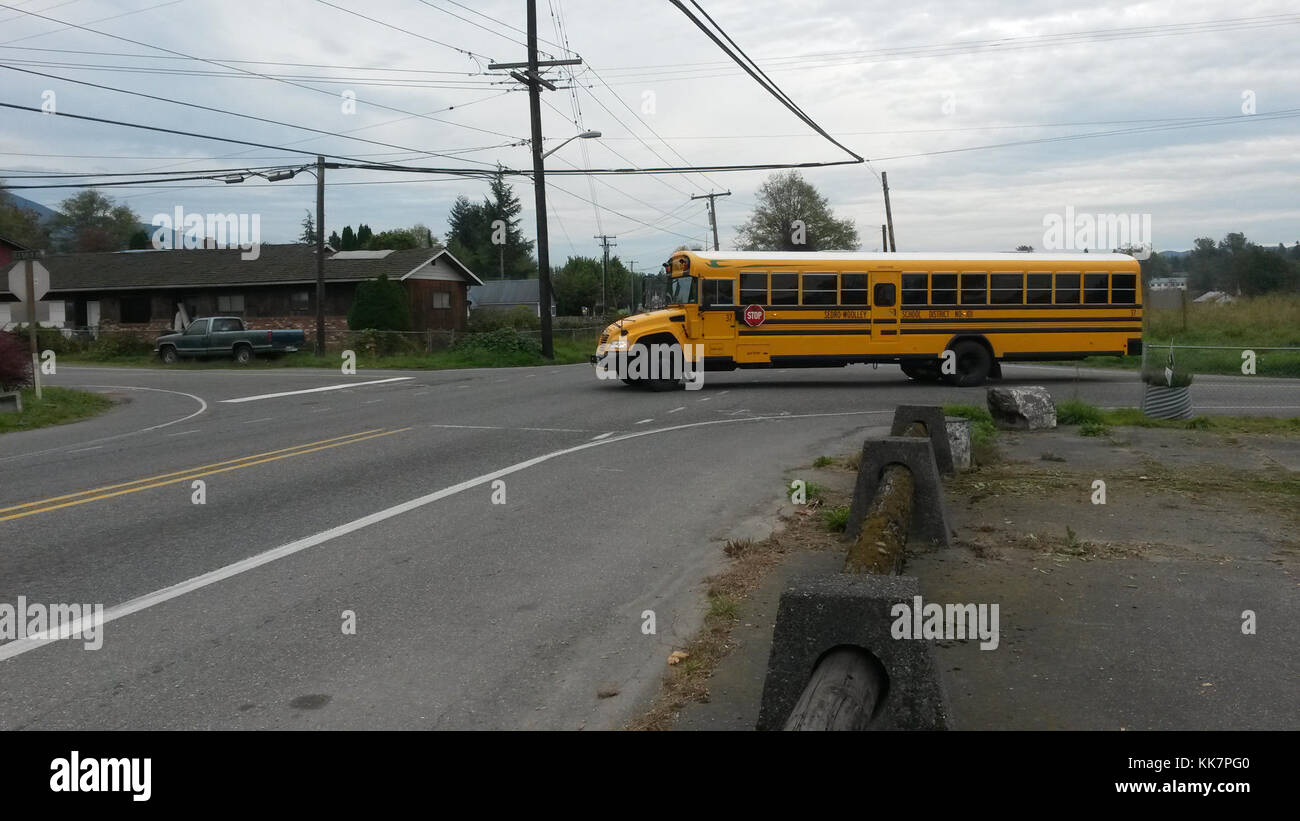 During the school year, about 25 buses run through this intersection ...