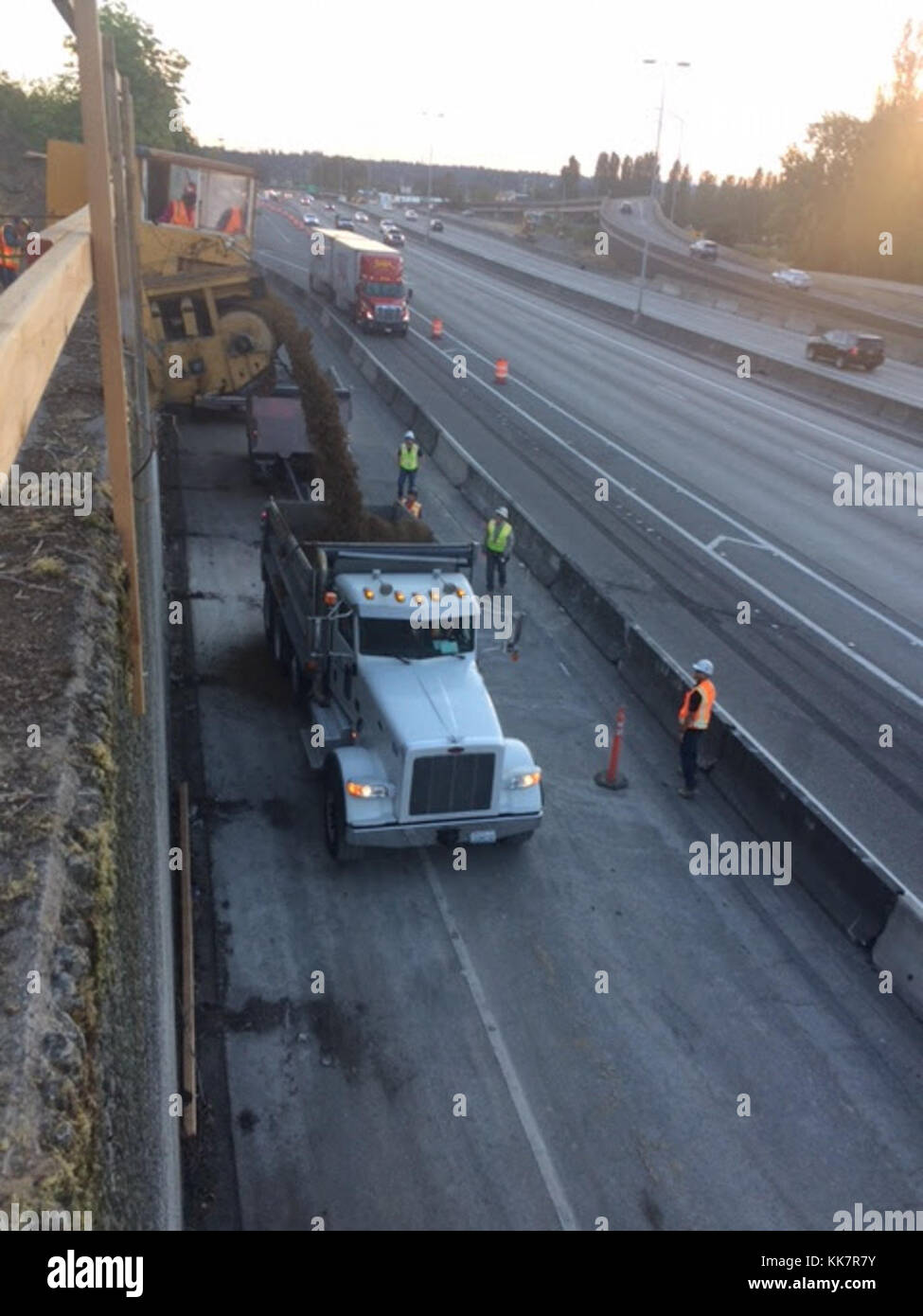 Dirt is loaded from a conveyor belt into a truck as part of mass ...