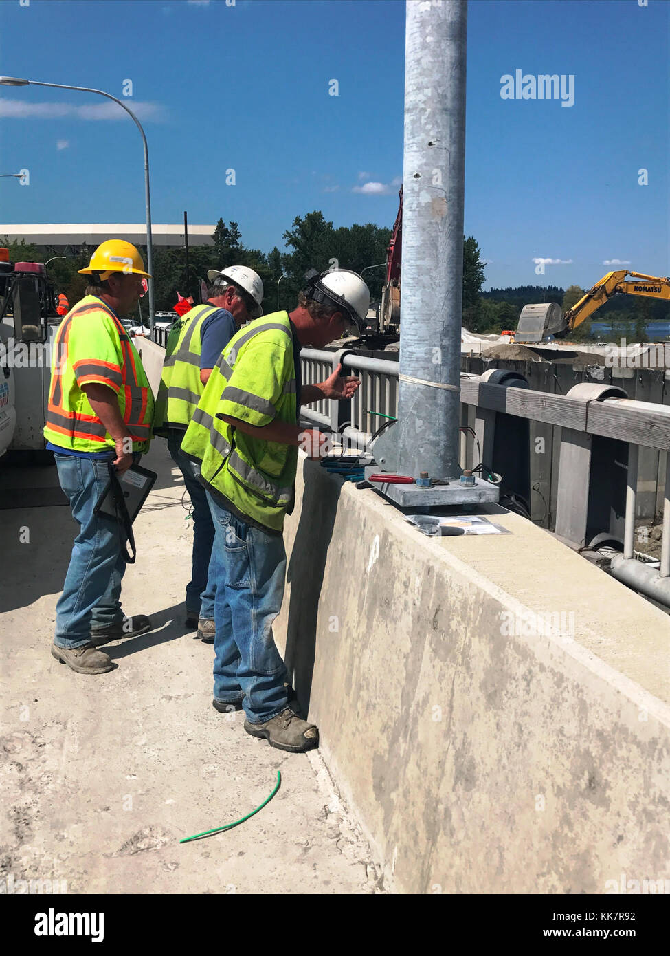 During a weekend closure, crews work on the electrical wiring for one ...