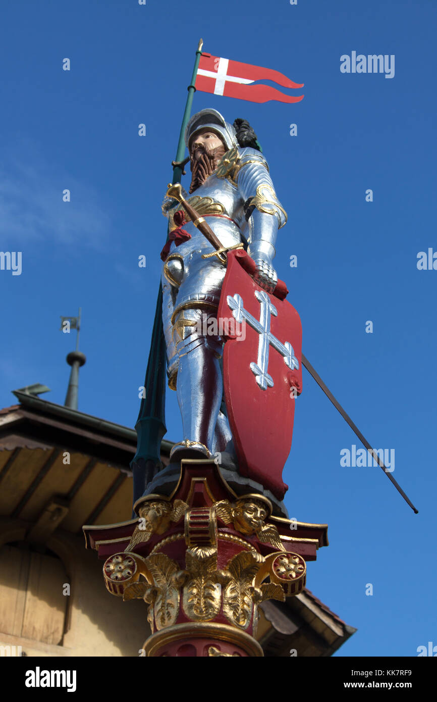 Town of Le Landeron, Switzerland. Picturesque view of the statue on top ...