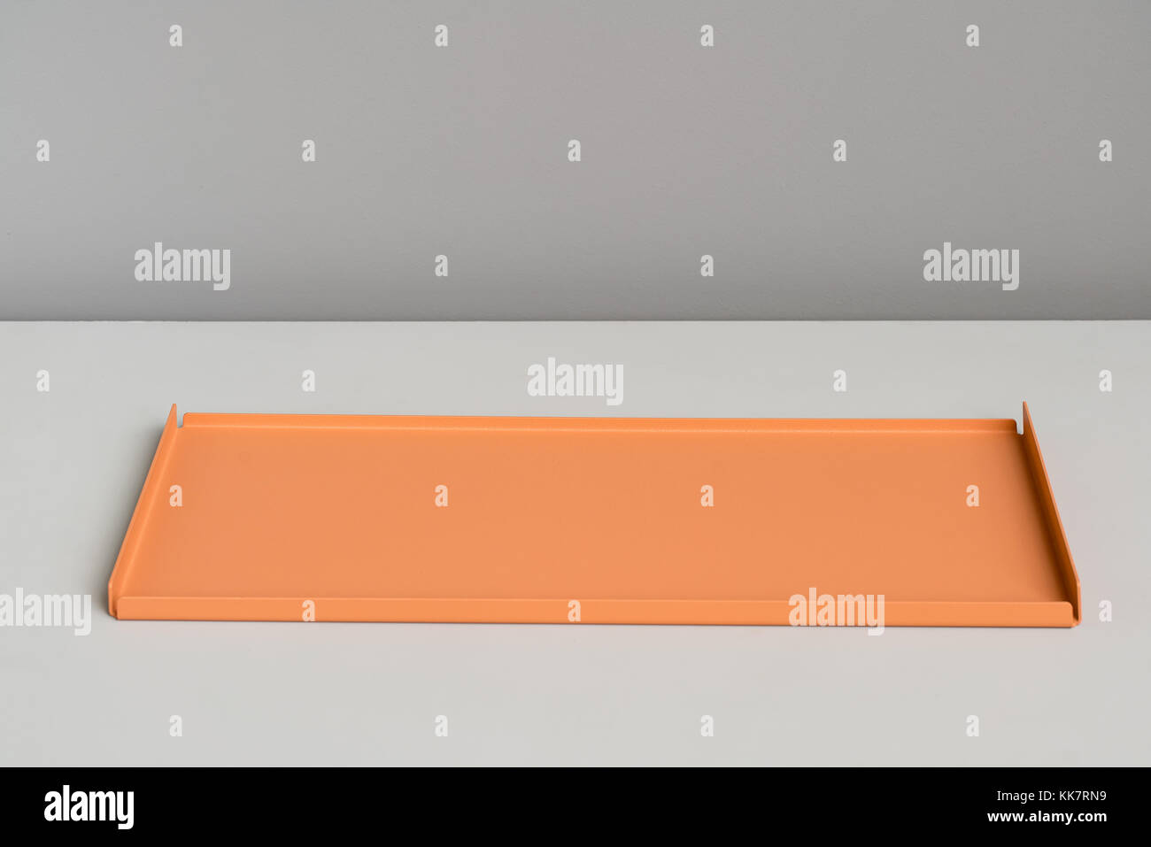 Metal orange support Stock Photo - Alamy