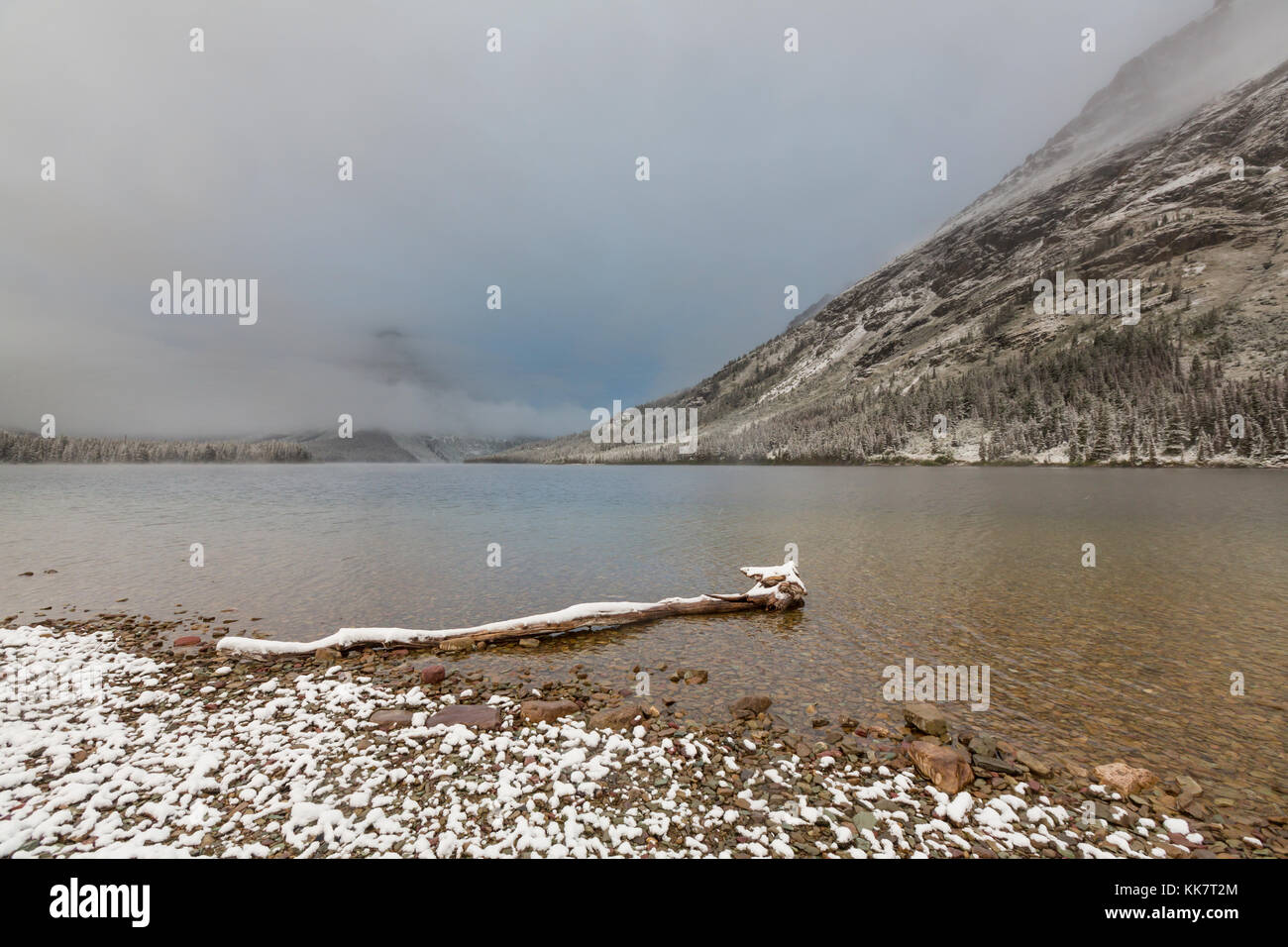 Early winter with first snow covering rocks and woods in the Glacier ...