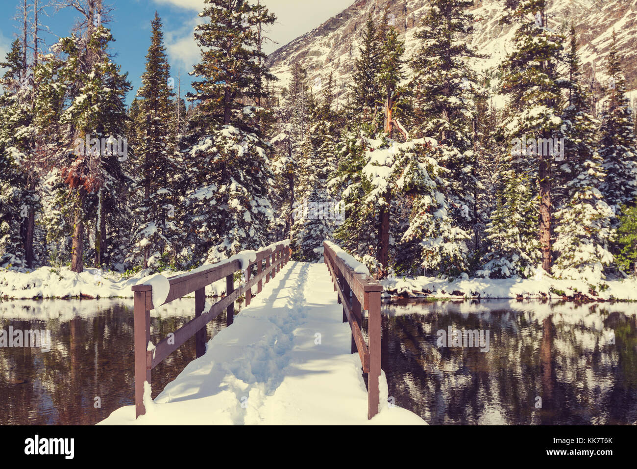 Early winter with first snow covering rocks and woods in the Glacier ...