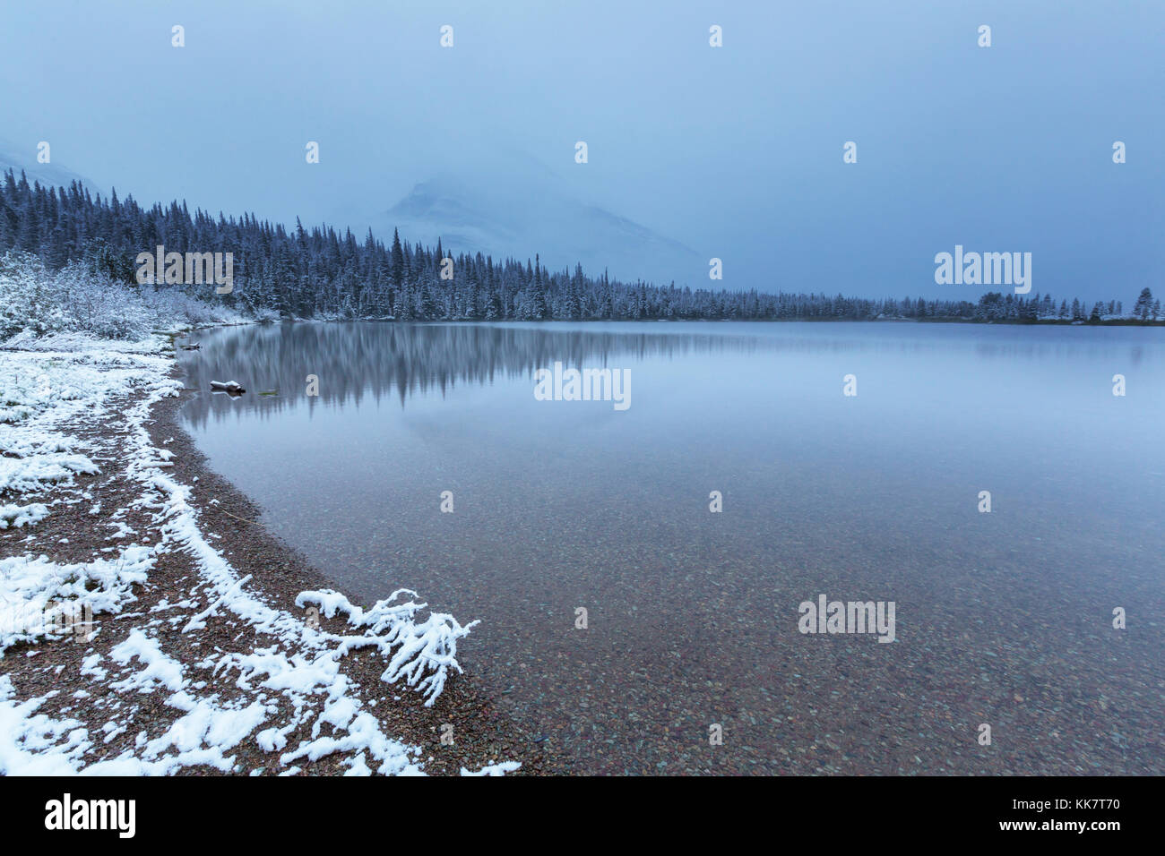Early winter with first snow covering rocks and woods in the Glacier ...
