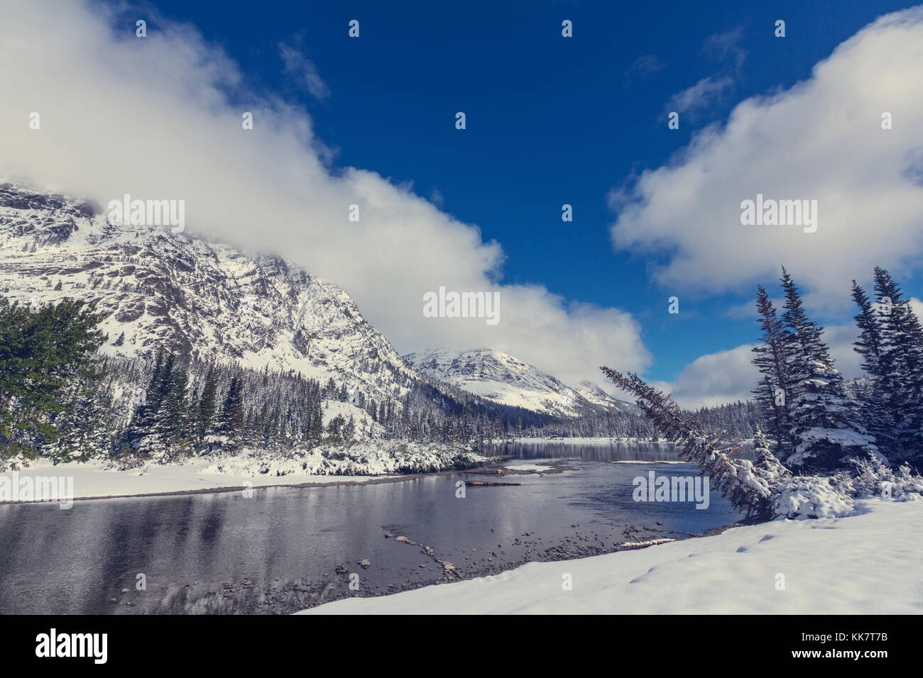 Early winter with first snow covering rocks and woods in the Glacier ...
