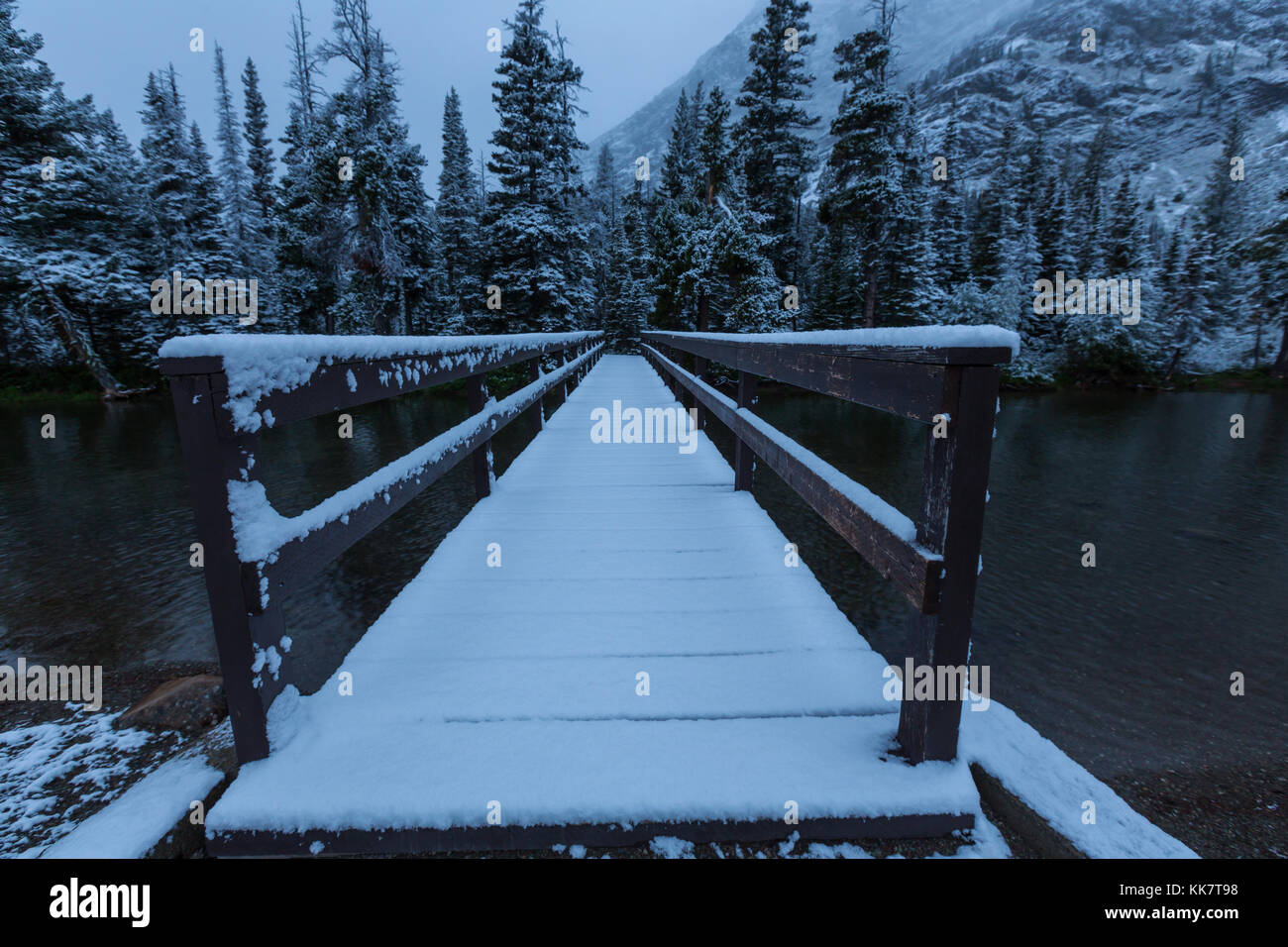 Early winter with first snow covering rocks and woods in the Glacier ...