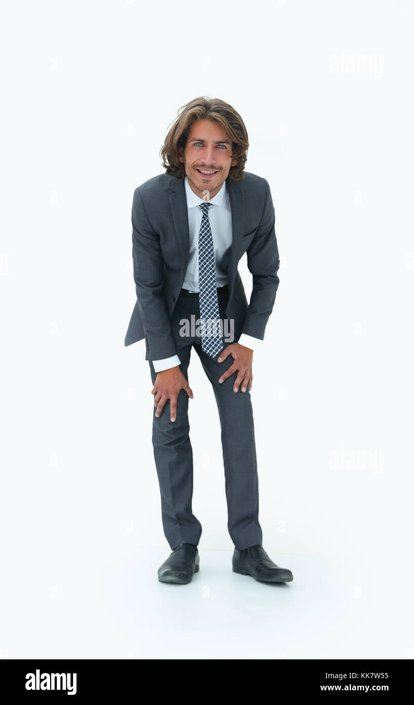 Young handsome businessman bending down Stock Photo - Alamy