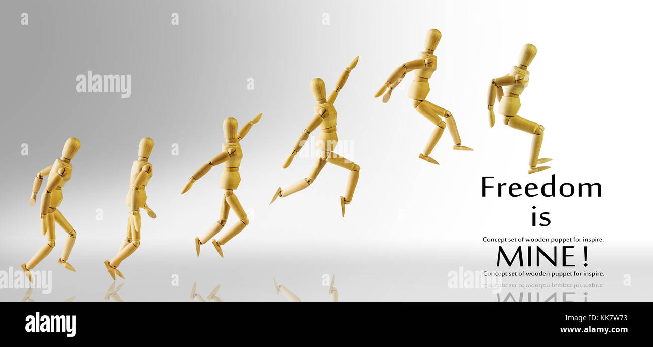 "Freedom is mine" wooden puppet jumping action step in white background ...