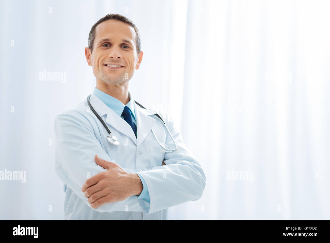 Portrait of positive male person that being at workplace Stock Photo ...