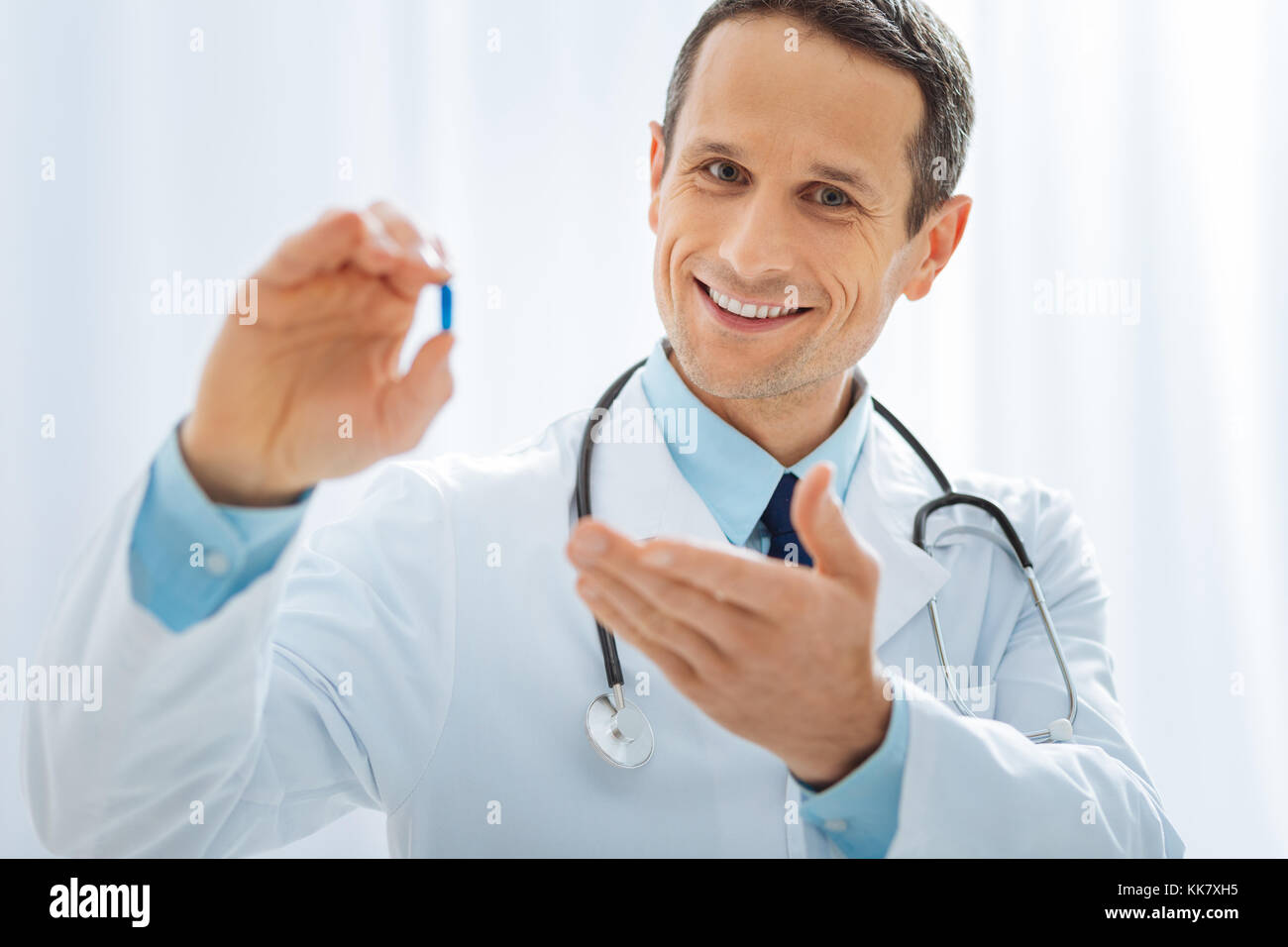 Professional doctor giving useful recommendations Stock Photo - Alamy