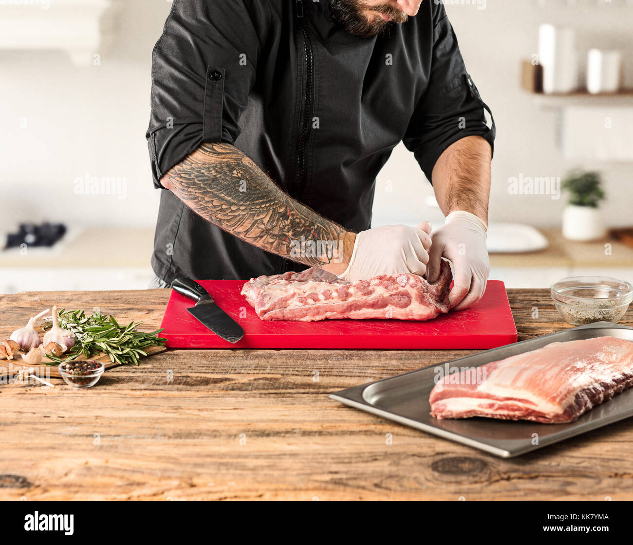 Man cooking meat steak on kitchen Stock Photo - Alamy
