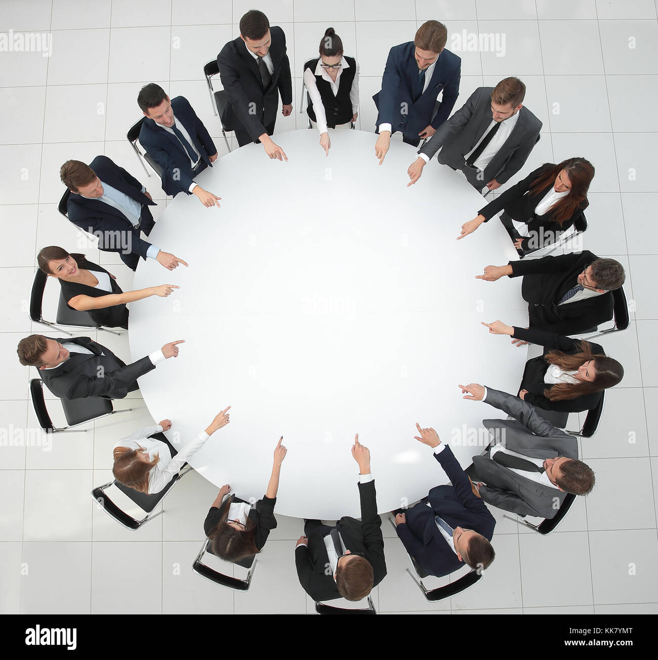 business team indicates the center of the round table Stock Photo - Alamy