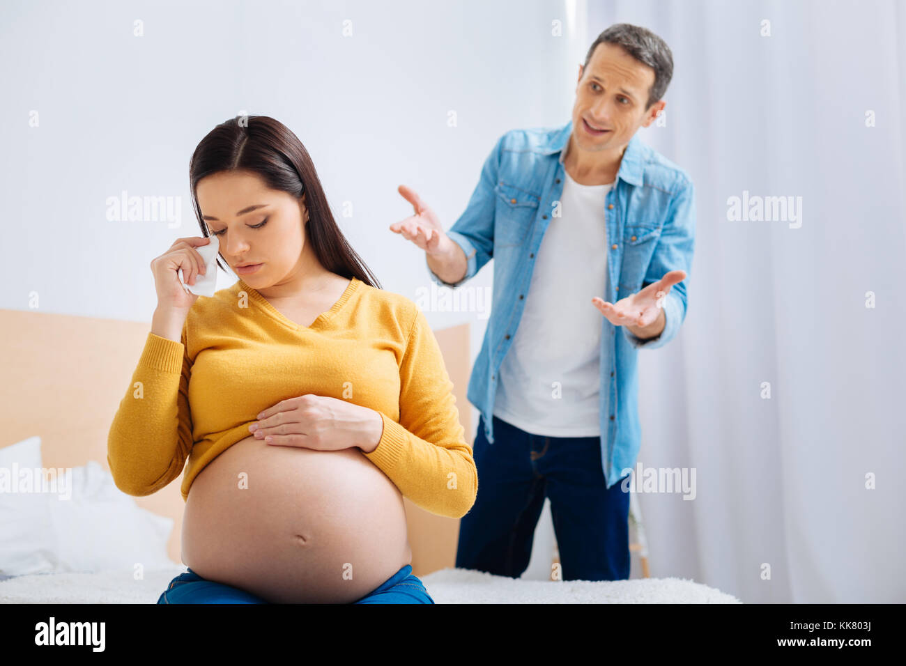 Sad female person looking downwards Stock Photo - Alamy