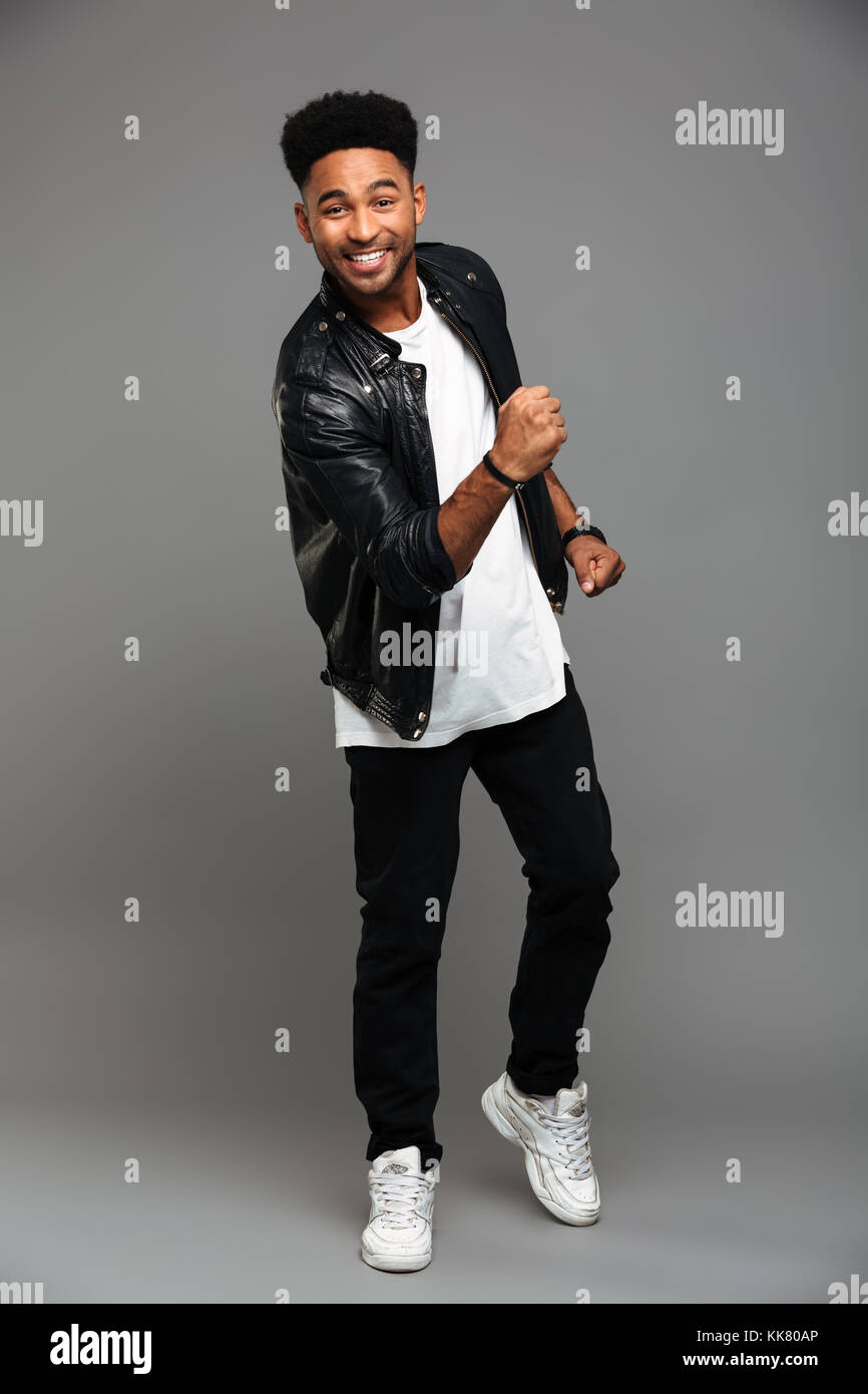 Full length photo of young afro american lucky man showing YES gesture ...