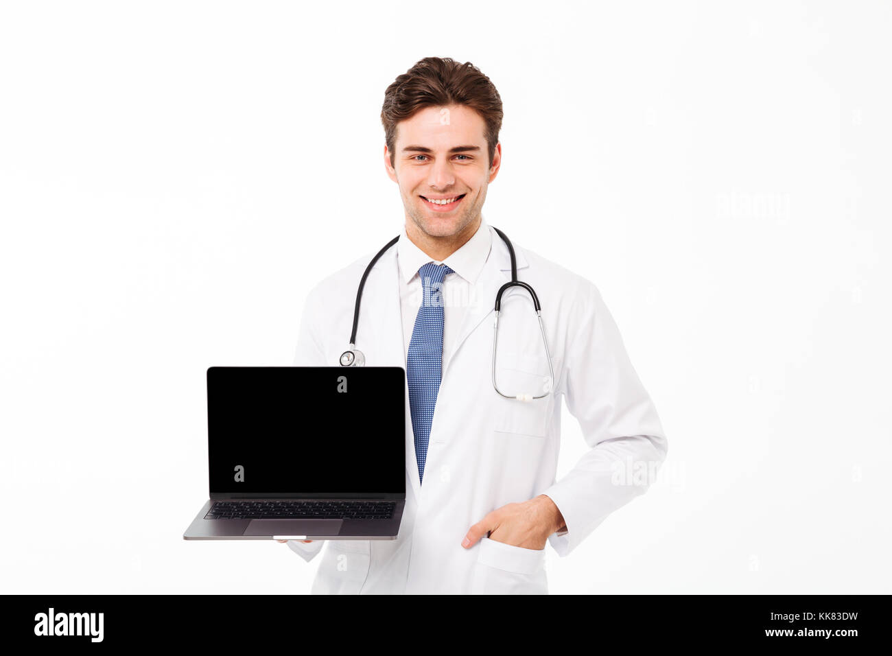 Portrait of a smiling young male doctor with stethoscope dressed in ...