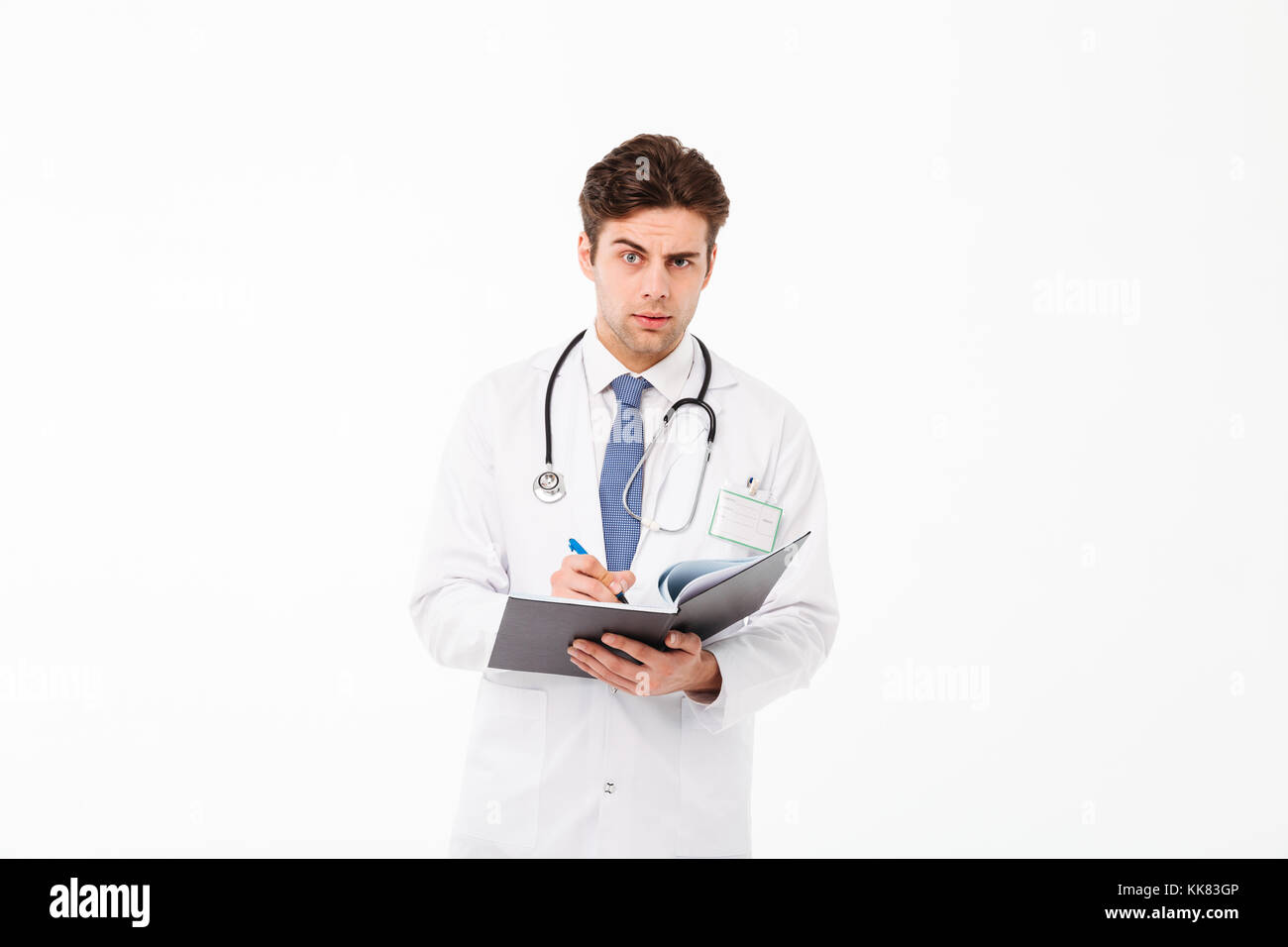 Portrait of confident young male doctor with stethoscope dressed in ...