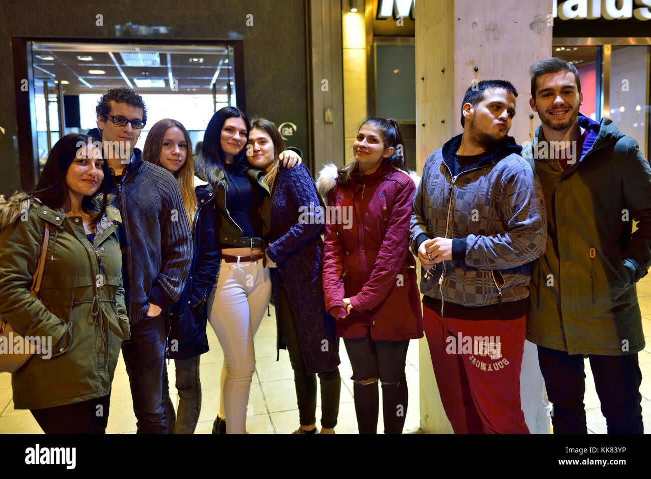 Group of friends on a night out in central Athens, near Syntagma Square ...
