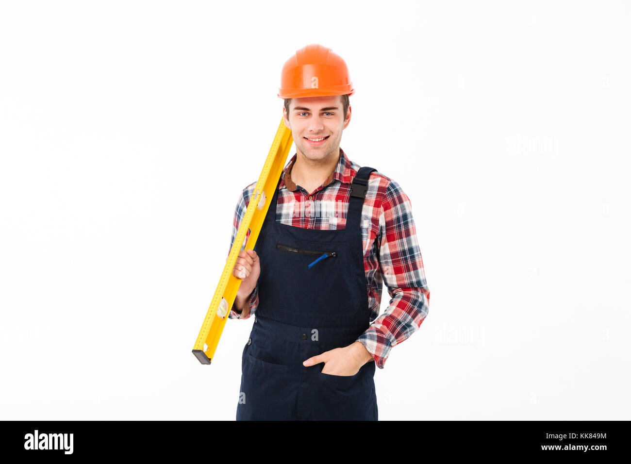 Smiling bricklayer holding level tool hi-res stock photography and ...