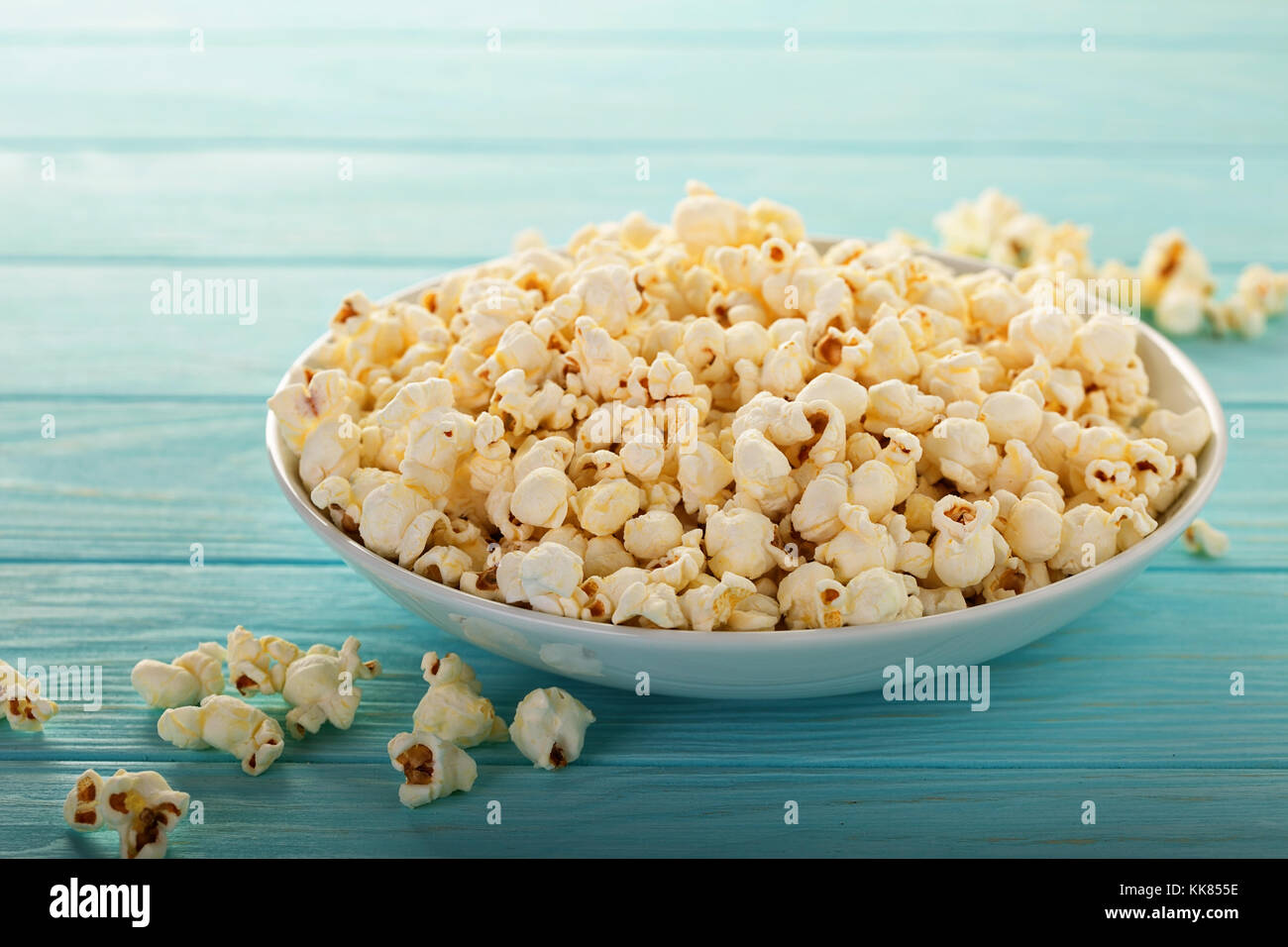 Cheddar cheese popcorn in a white bowl Stock Photo - Alamy