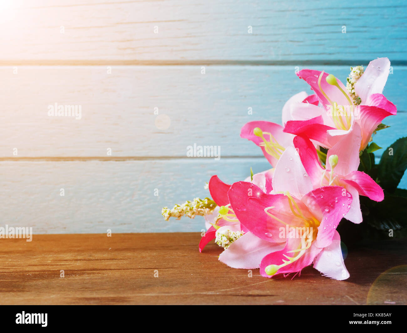 Beautiful pink flowers Put on wooden board Stock Photo - Alamy
