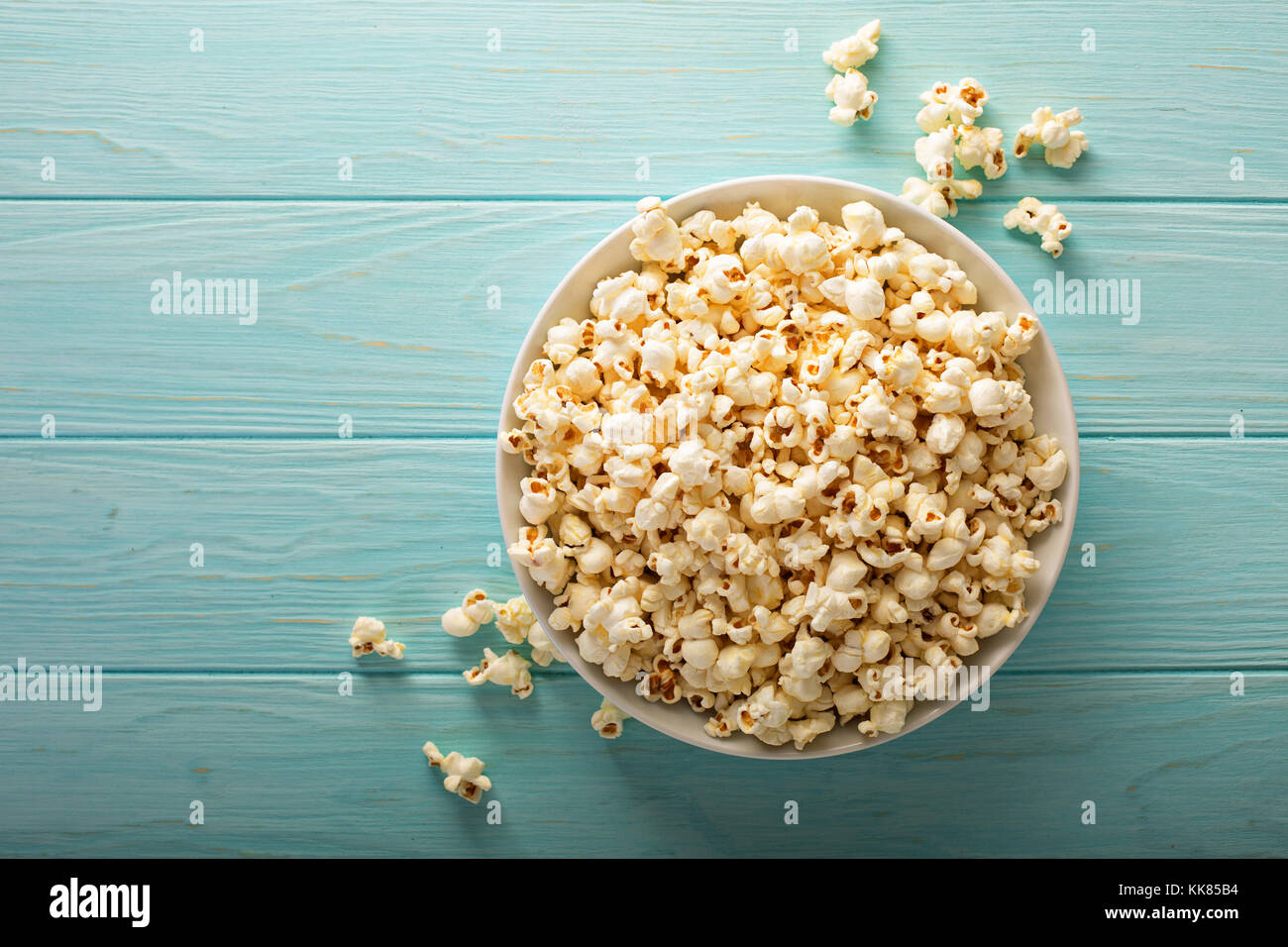 Cheddar cheese popcorn in a white bowl Stock Photo - Alamy