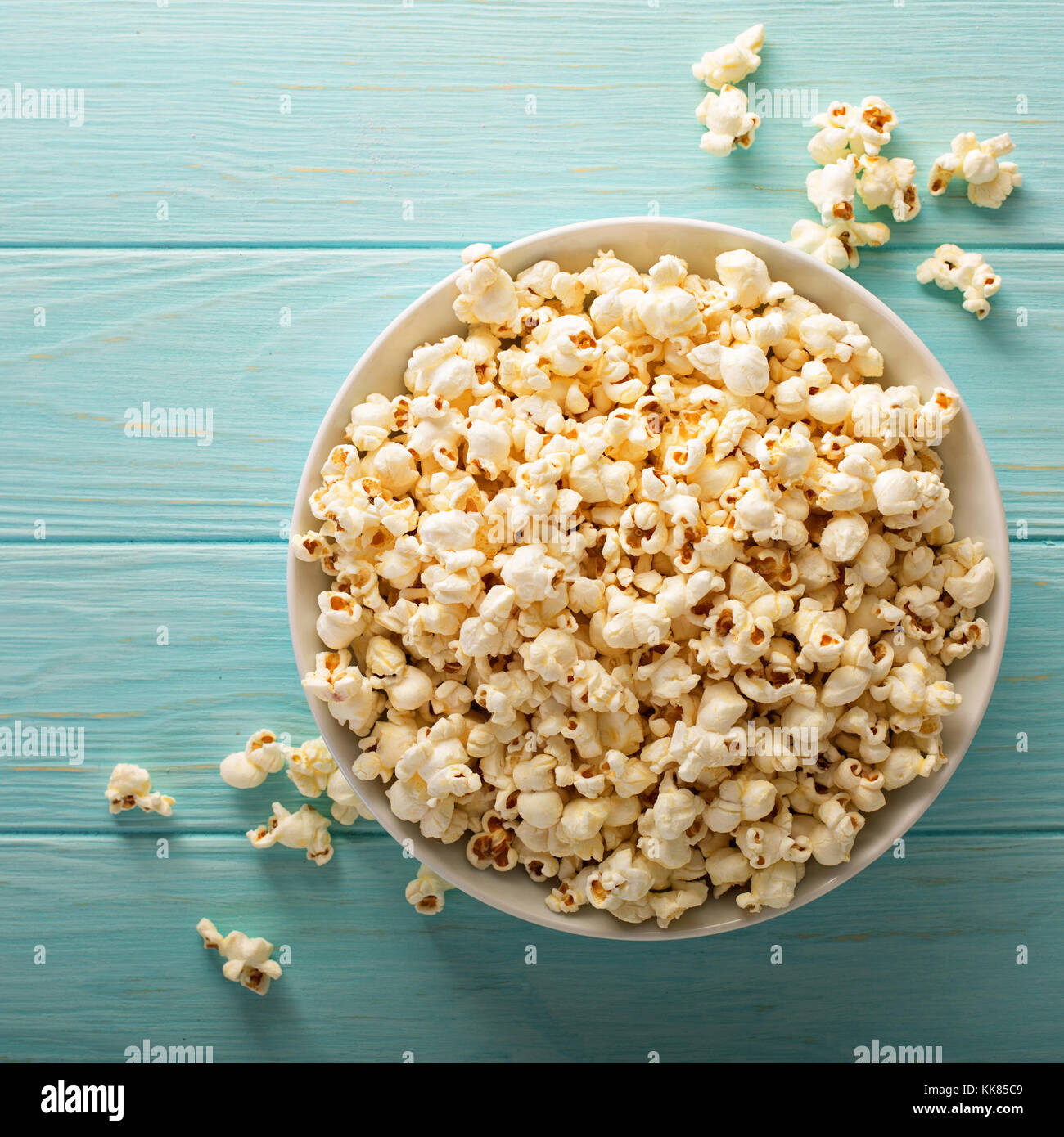 Cheddar cheese popcorn in a white bowl Stock Photo - Alamy