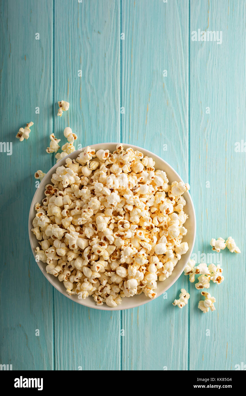 Cheddar cheese popcorn in a white bowl Stock Photo - Alamy