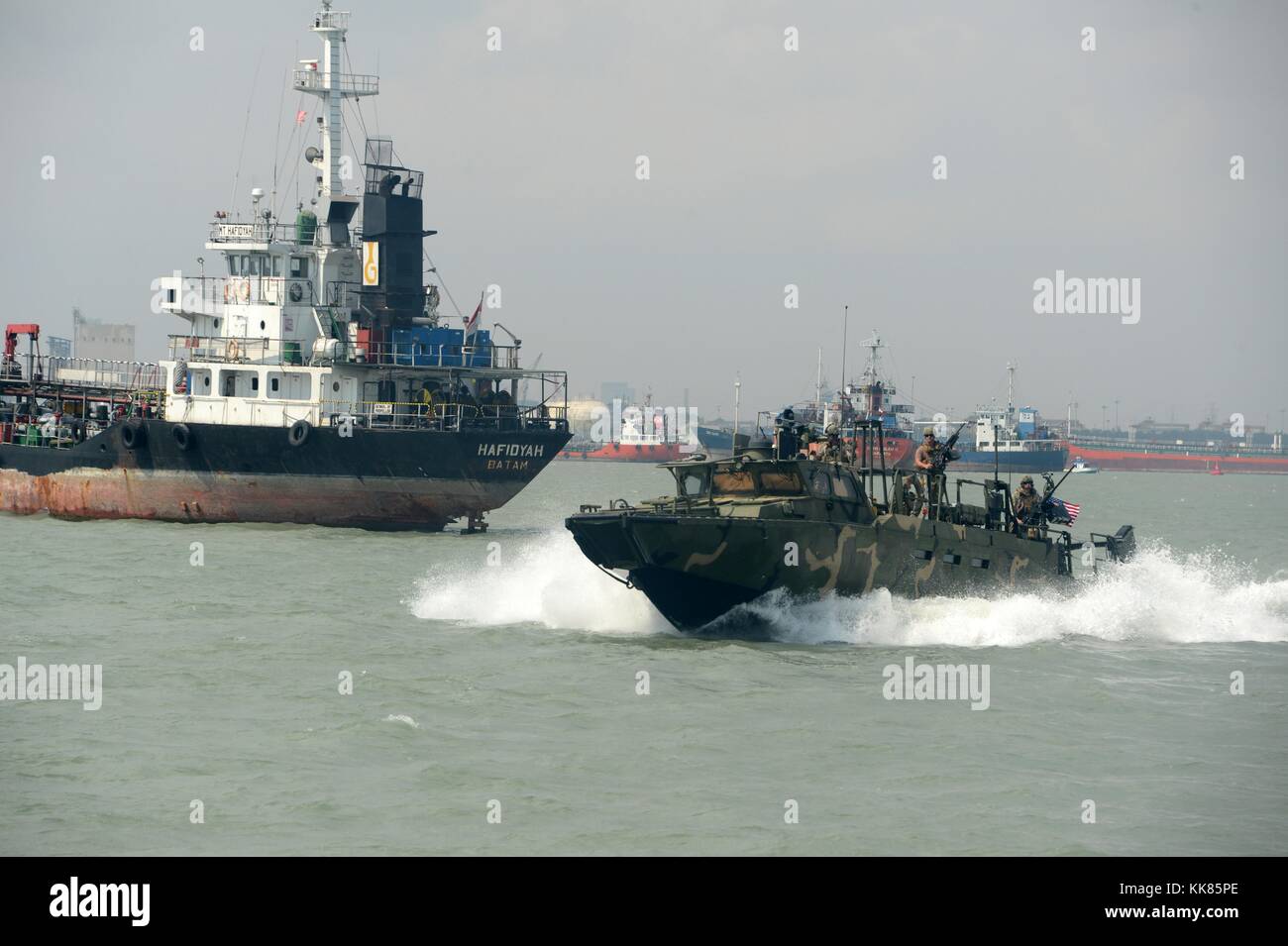 Sailors assigned to Coastal Riverine Squadron CRS 3 and Indonesian ...