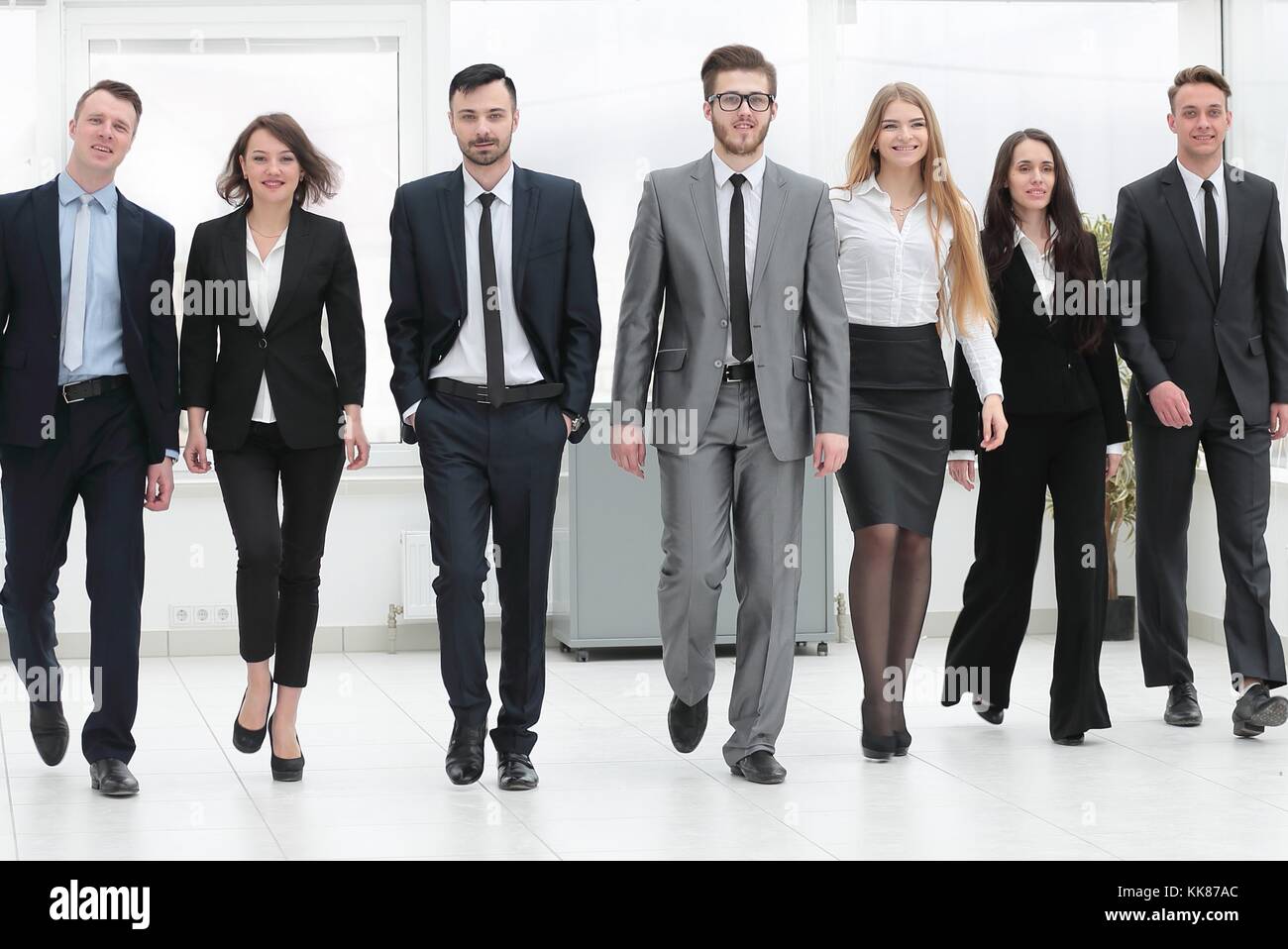 bottom view. business team walking forward Stock Photo - Alamy