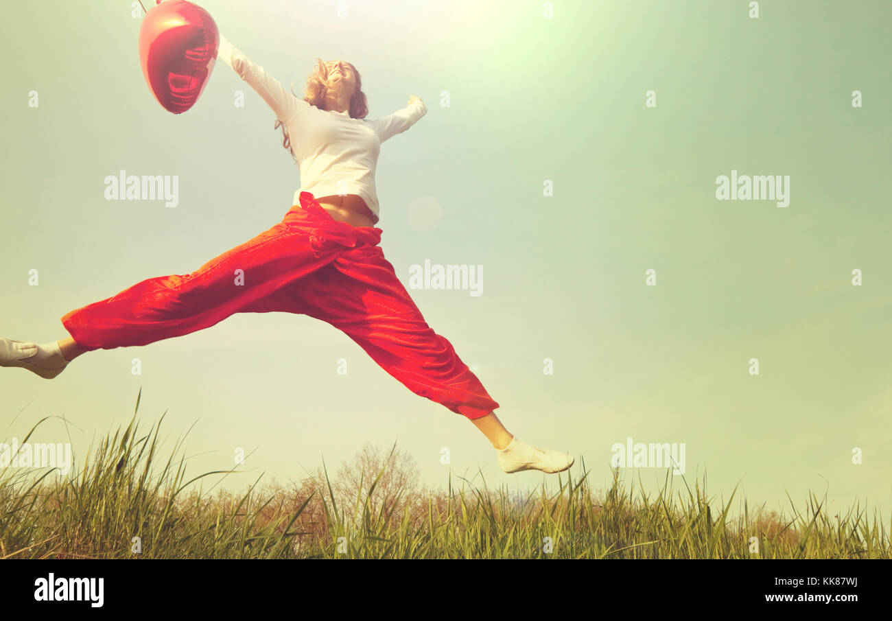Jumping happy girl Stock Photo - Alamy