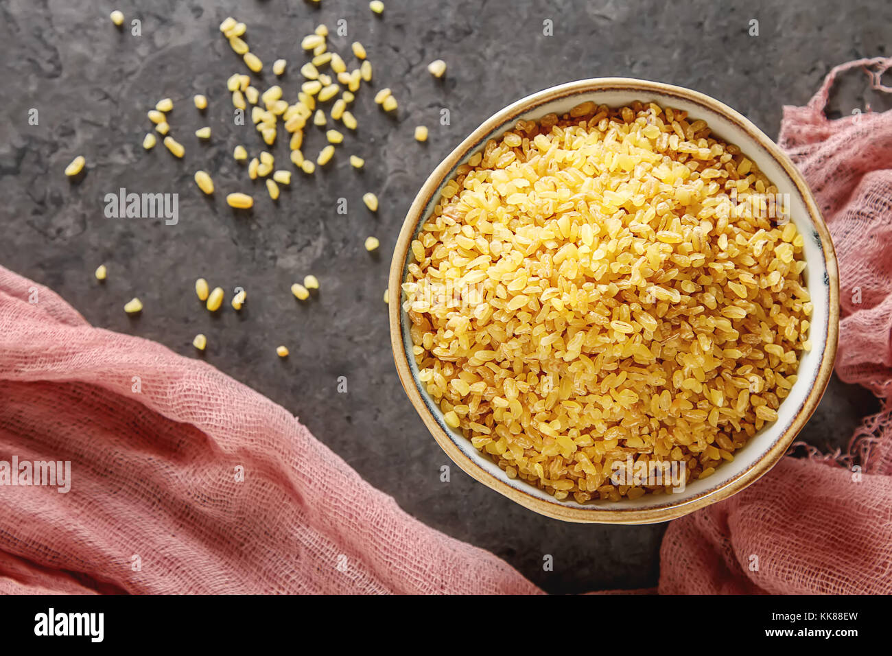 Bulgur on a dark background. Vegetarian Oriental food Stock Photo - Alamy