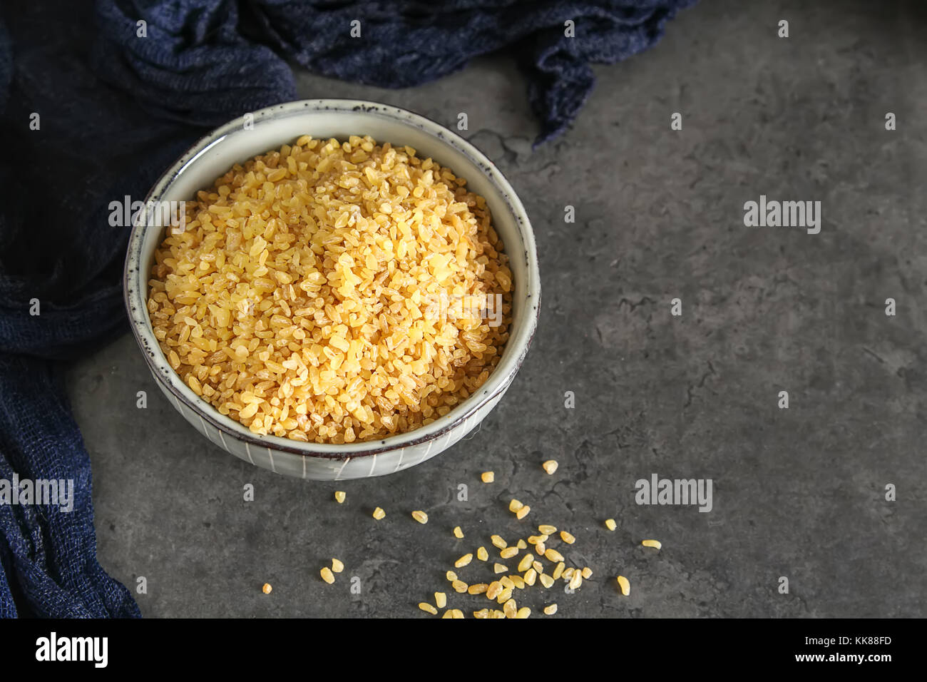 Bulgur on a dark background. Vegetarian Oriental food Stock Photo - Alamy