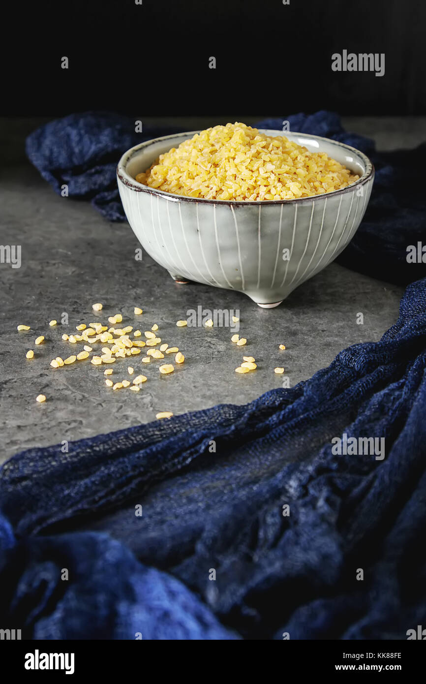 Bulgur on a dark background. Vegetarian Oriental food Stock Photo - Alamy