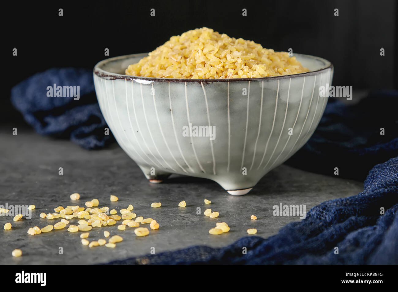 Bulgur on a dark background. Vegetarian Oriental food Stock Photo - Alamy
