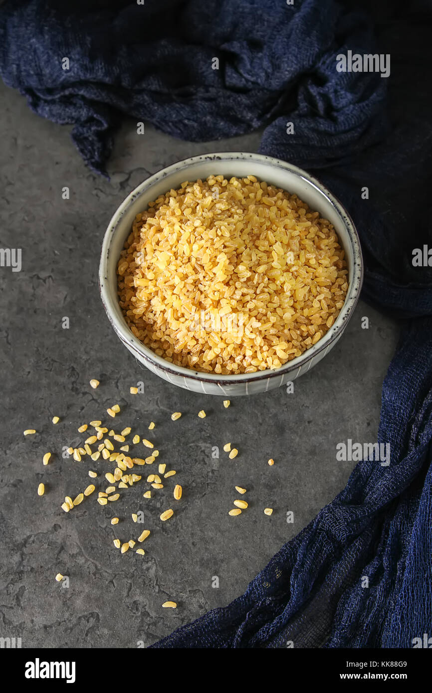Bulgur on a dark background. Vegetarian Oriental food Stock Photo - Alamy