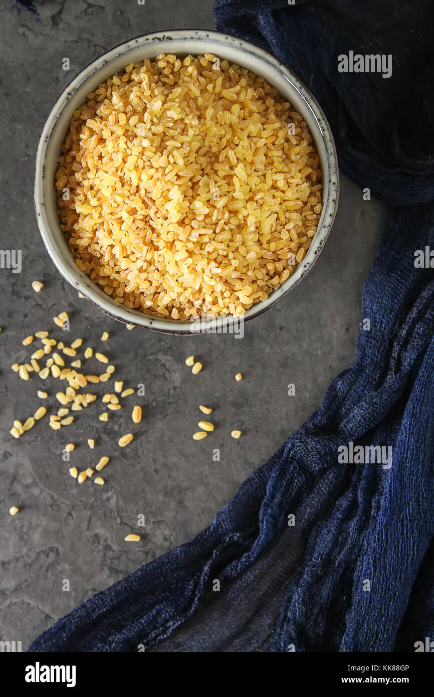 Bulgur on a dark background. Vegetarian Oriental food Stock Photo - Alamy