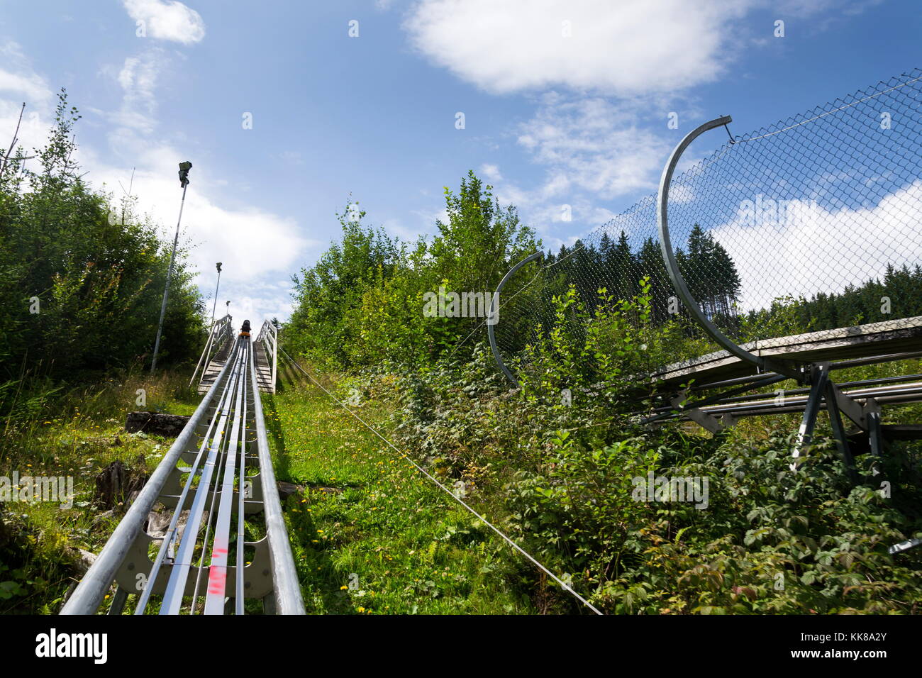 Bobsled Roller Coaster Toboggan in summer day, Rittisberg, Alps ...