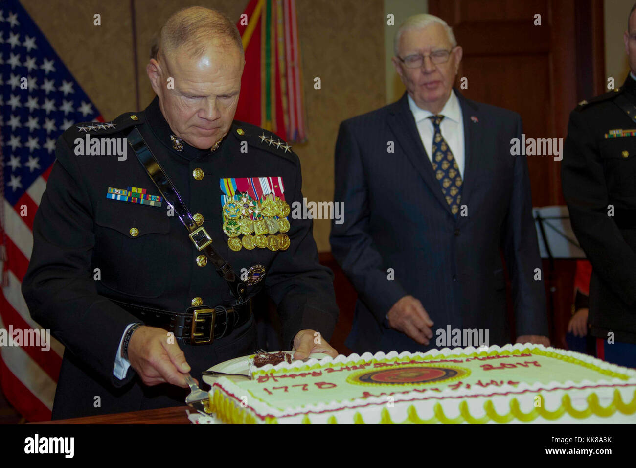 Commandant of the Marine Corps Gen. Robert B. Neller cuts a cake at the ...
