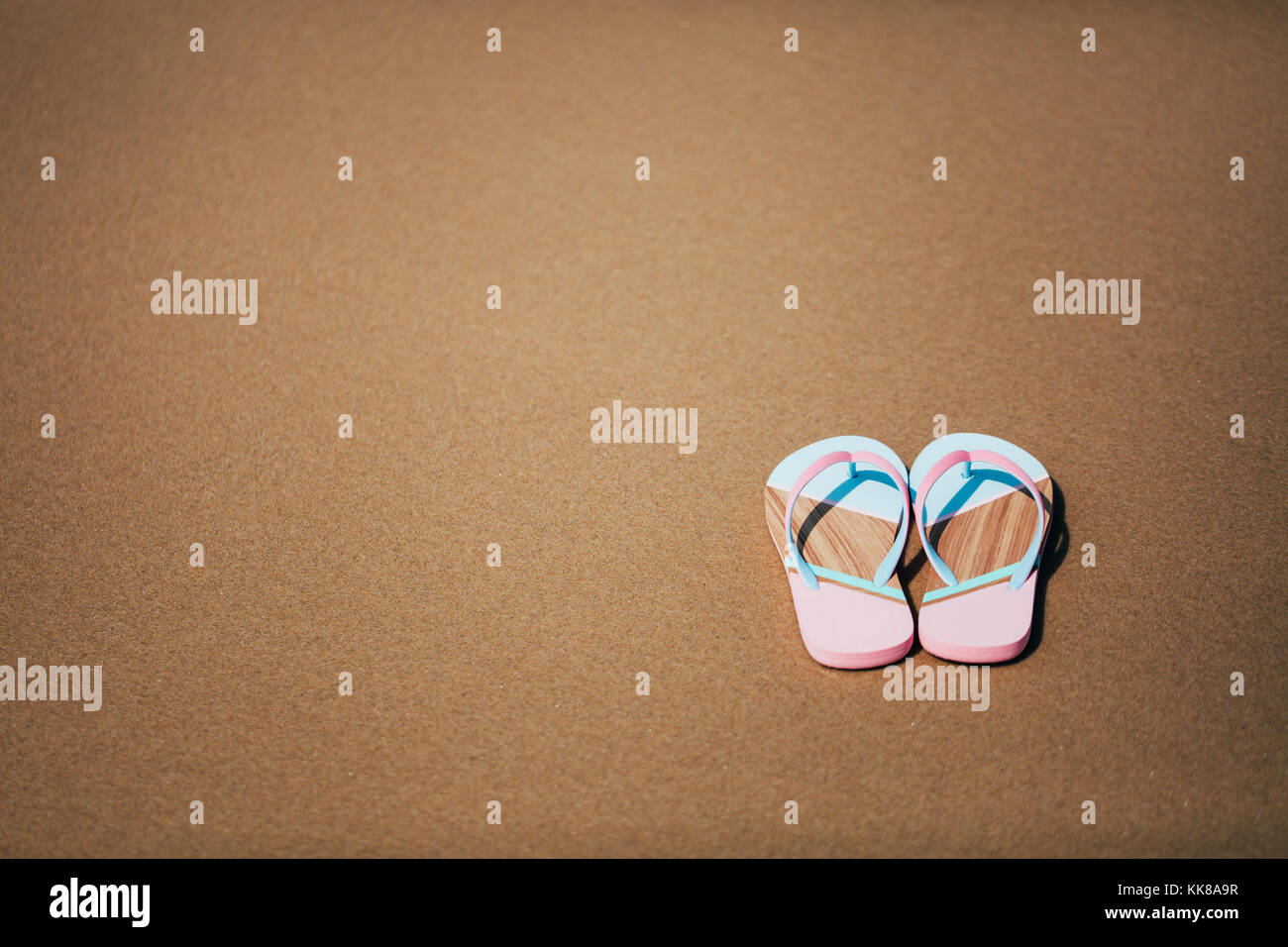 Trendy slippers on the sandy beach Stock Photo - Alamy