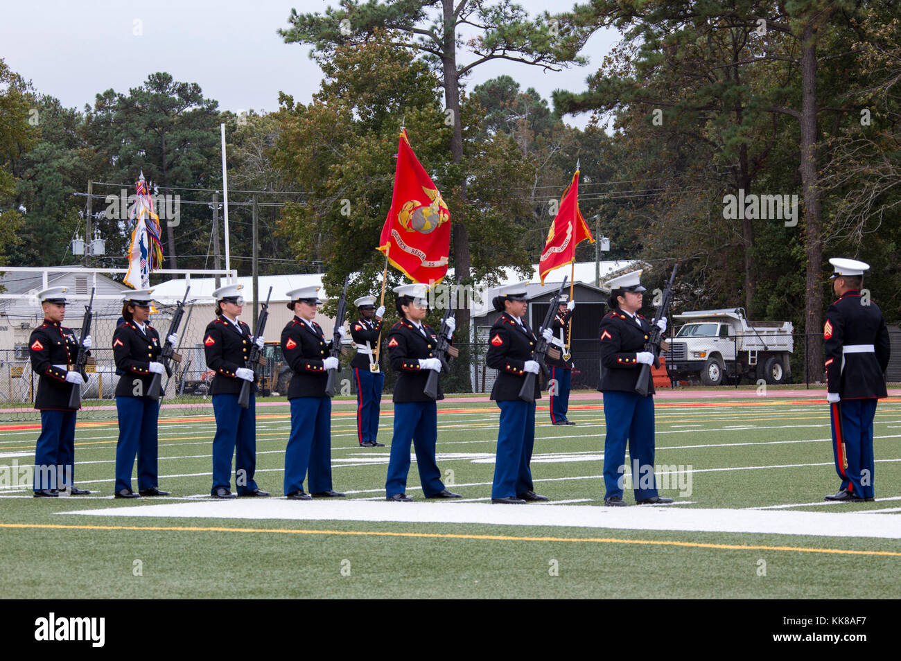 U.S. Marines with the rifle detail conduct a rifle salute during the ...