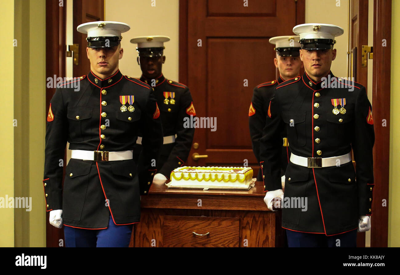 A cake cutting detail with Marine Barracks Washington D.C. marches in ...
