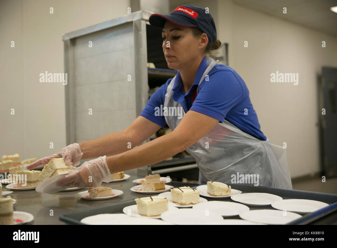 Jessica Hurtado, Sedexo employee, transfers cake slices for display in ...