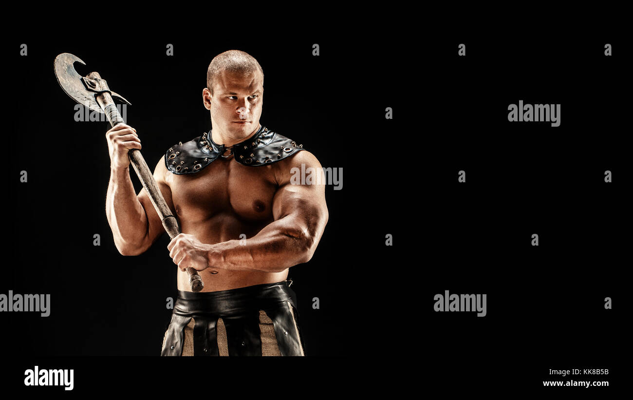 Severe barbarian in leather costume with hammer Stock Photo - Alamy