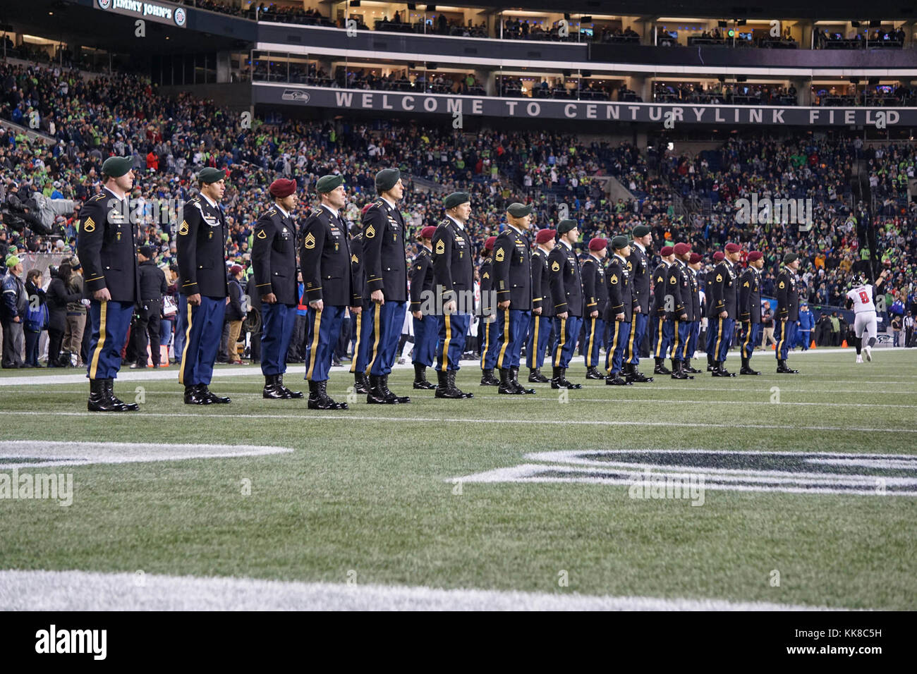 Soldiers with 1st Special Forces Group (Airborne) stand ready to salute ...