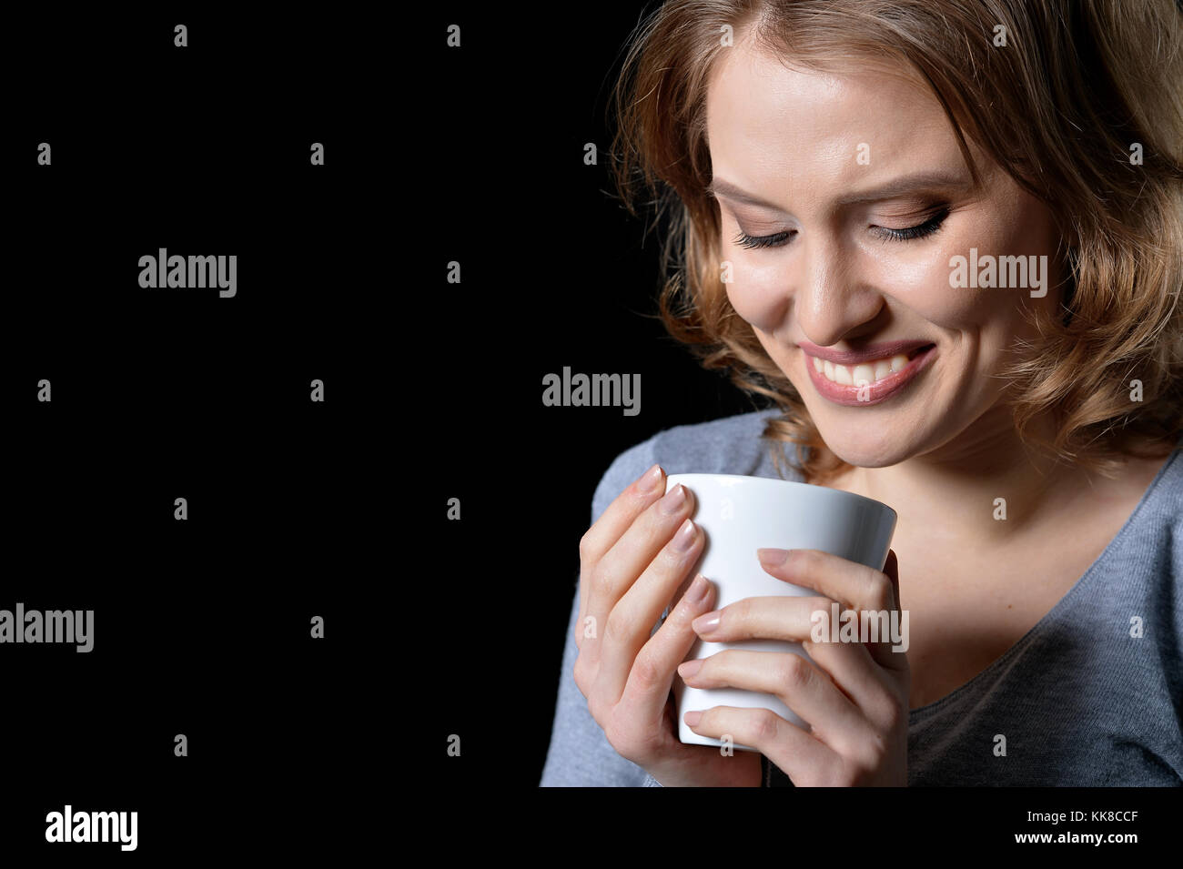 Nice blonde with cup Stock Photo - Alamy
