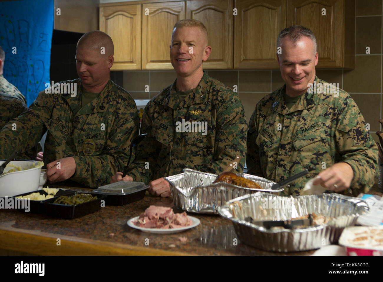 CAMP FOSTER, OKINAWA, Japan – Brig. Gen. Paul Rock Jr, center, serves ...