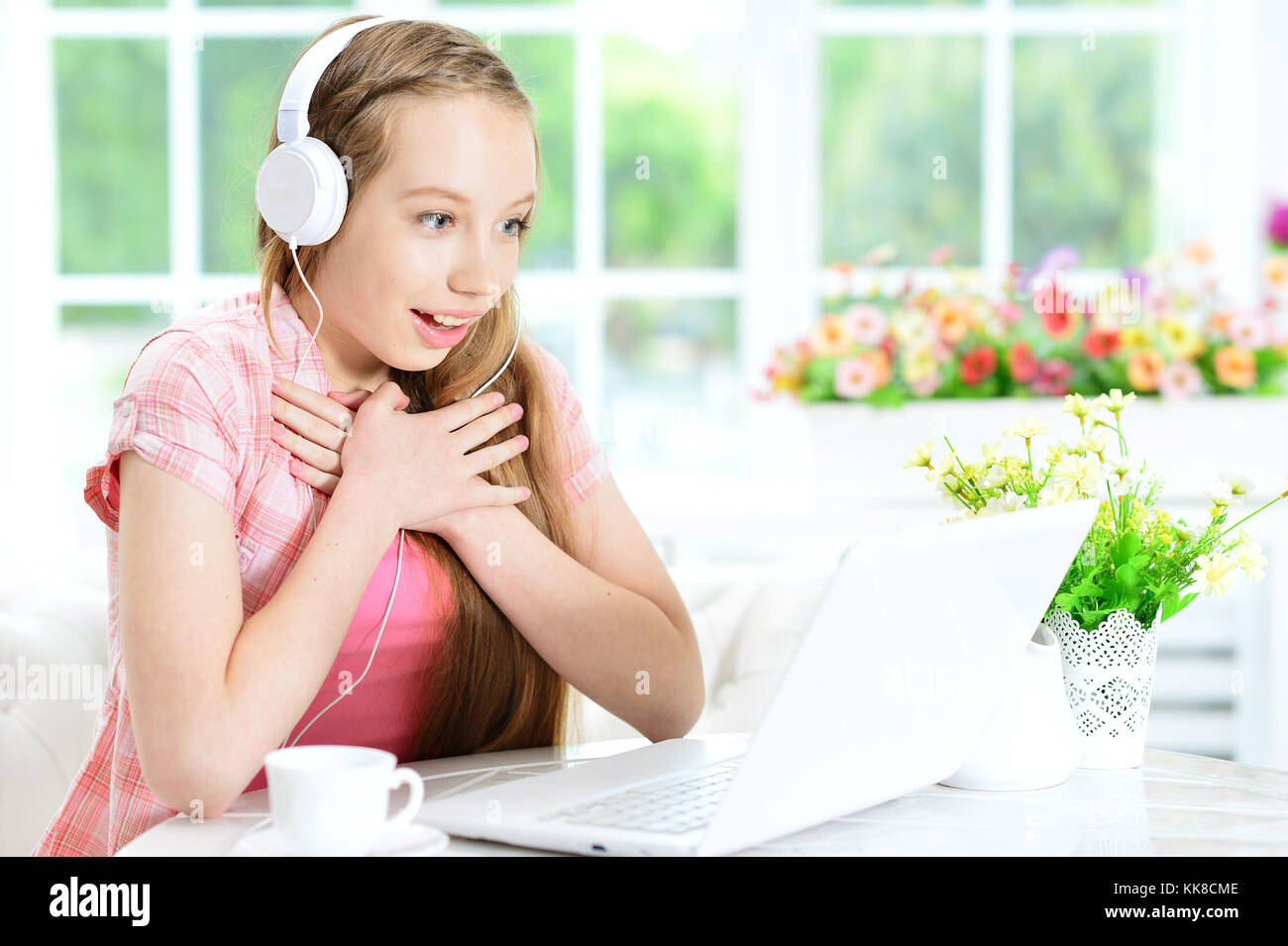 Teen girl using laptop Stock Photo - Alamy