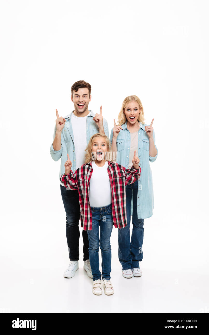 Full length portrait of a happy cheerful young family with a child ...