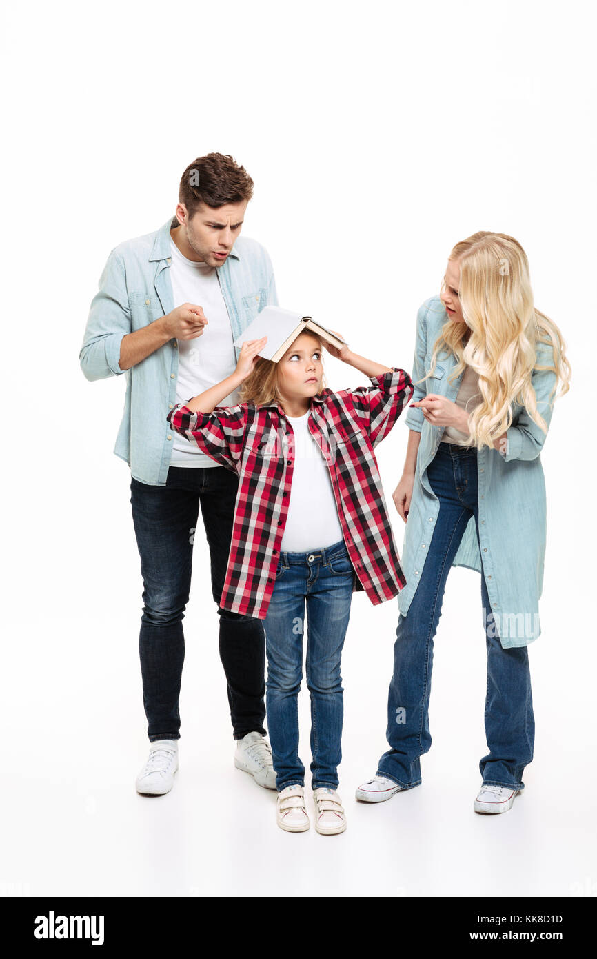 Full length portrait of a family having and argument with a child ...
